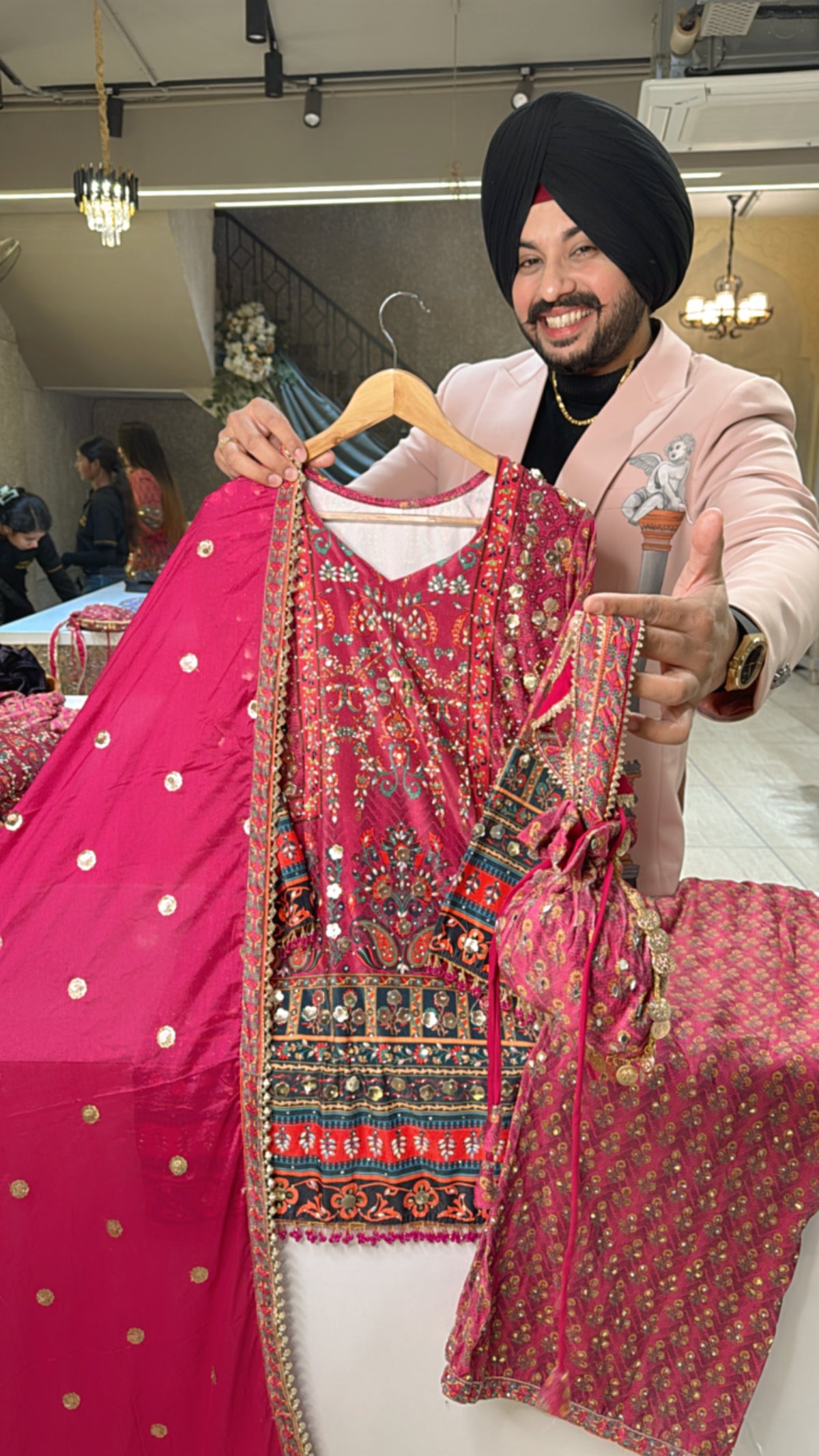 Rani pink Velvet Heavy embroidered Indowestern Suit with Plazo & Potli